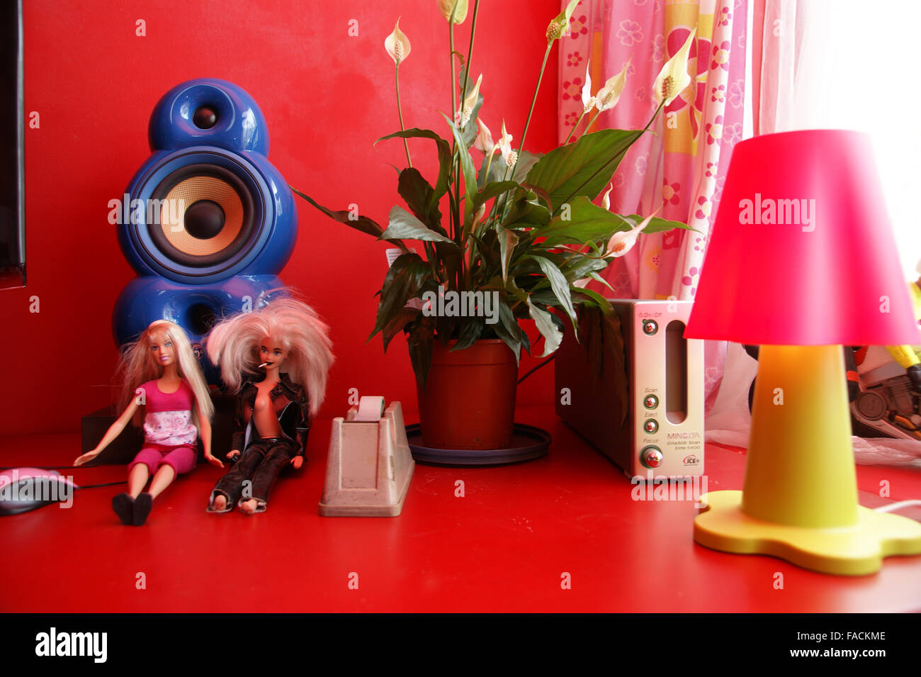 Barbie dolls sitting on a pink desk Stock Photo - Alamy