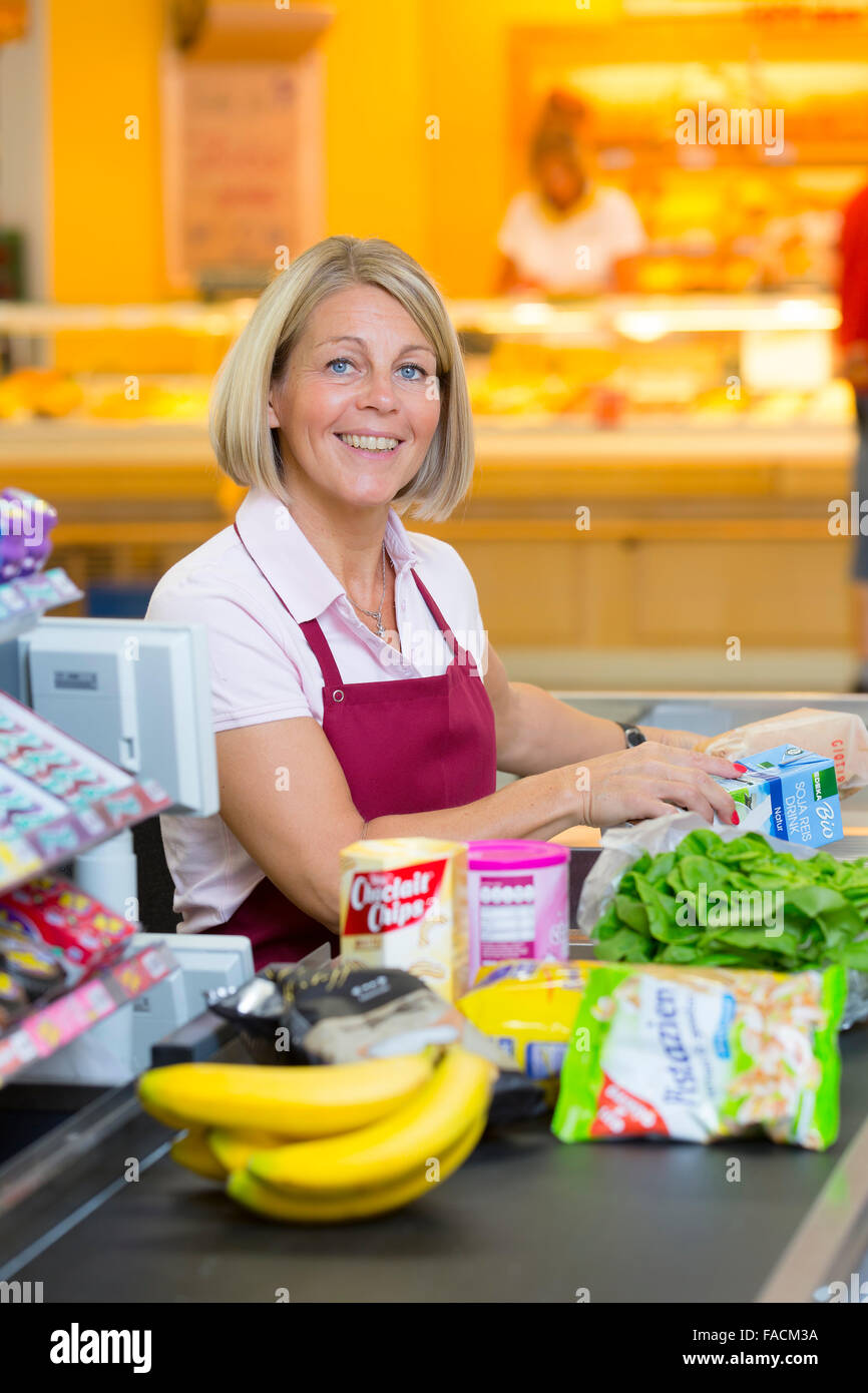 Portrait of woman cashier hi-res stock photography and images - Alamy