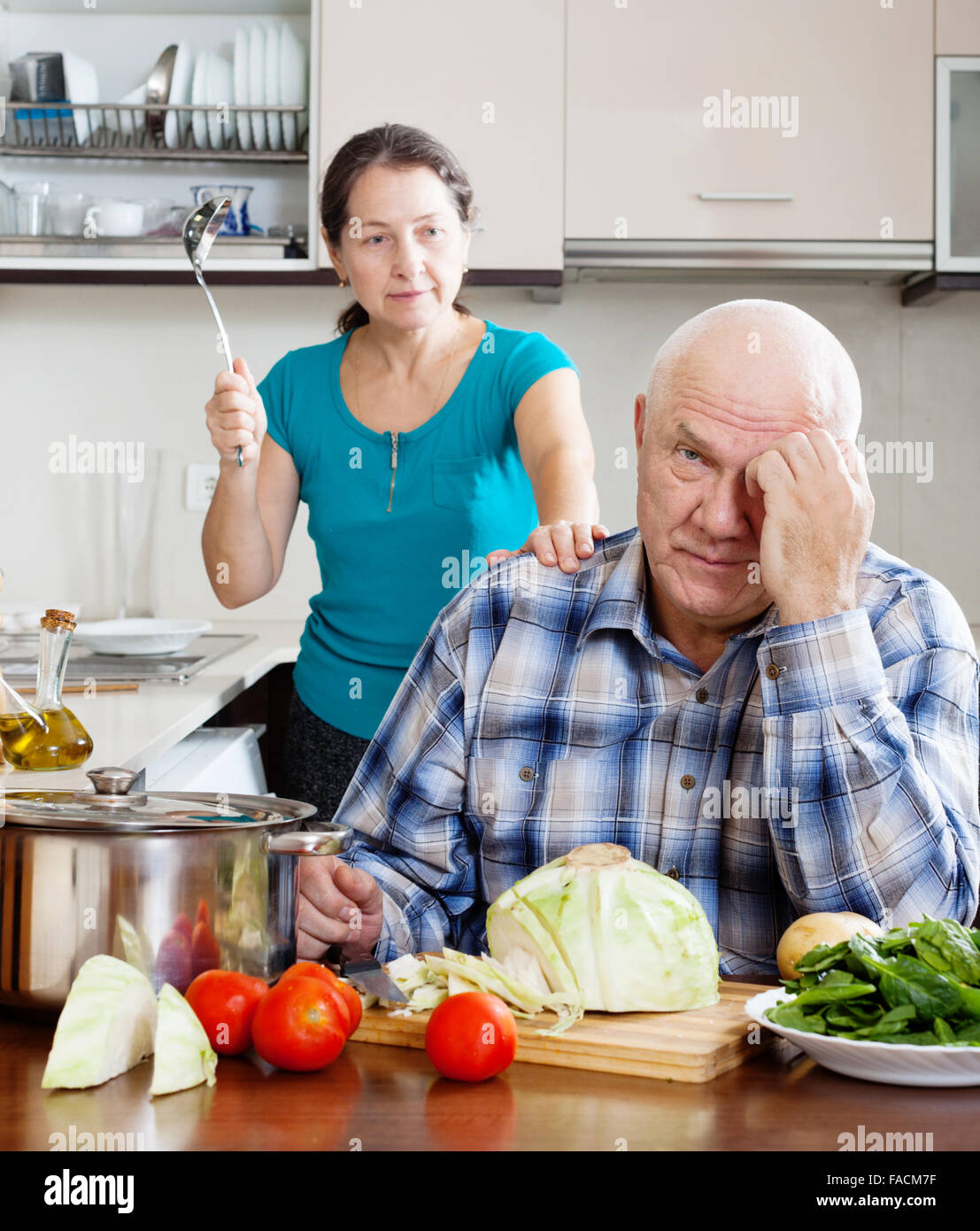 Mature woman cooking stress hi-res stock photography and images - Alamy