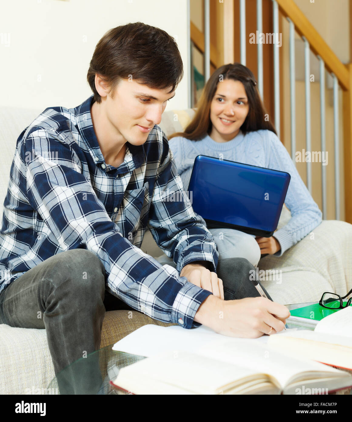 students doing homework together at home Stock Photo - Alamy