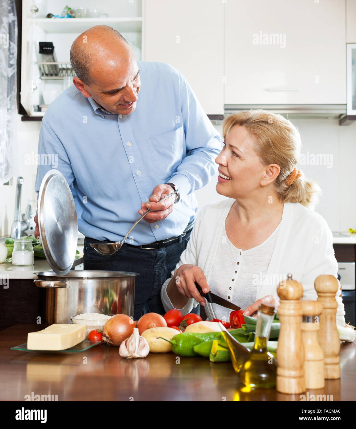 senior couple cooking at their kitchen at home Stock Photo - Alamy