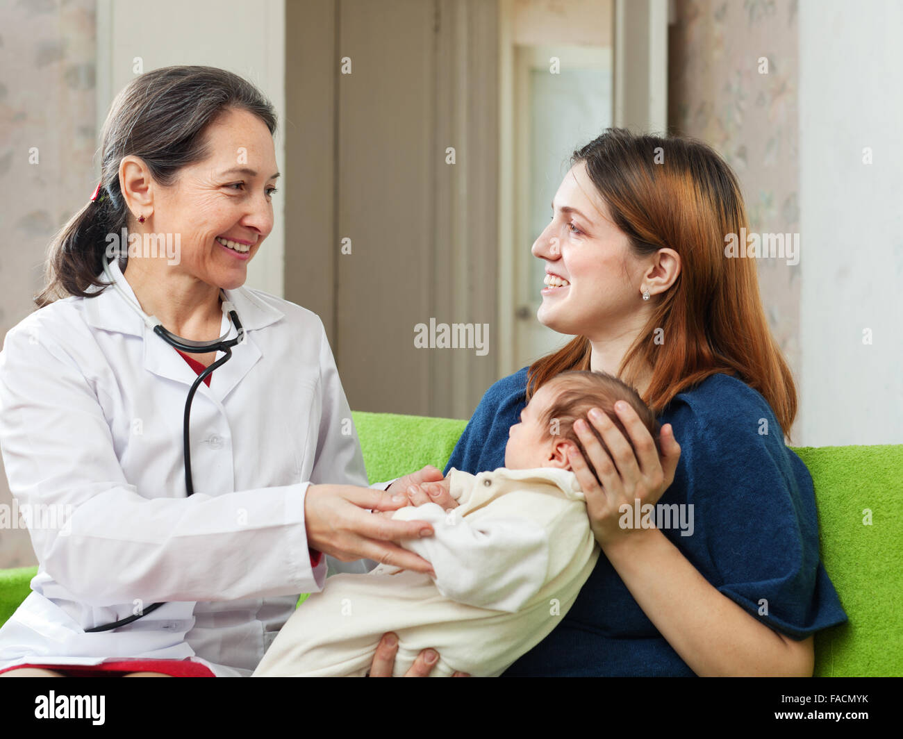 pediatrician doctor examining newborn baby Stock Photo - Alamy