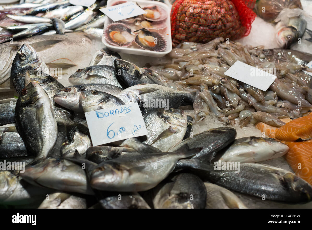Raw fresh fish on market counter Stock Photo - Alamy