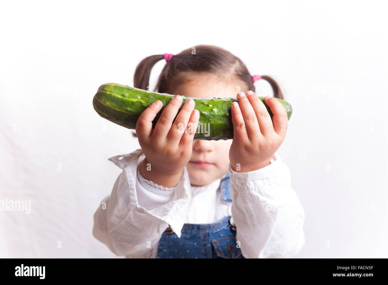 Girl with cucumber hi-res stock photography and images - Alamy