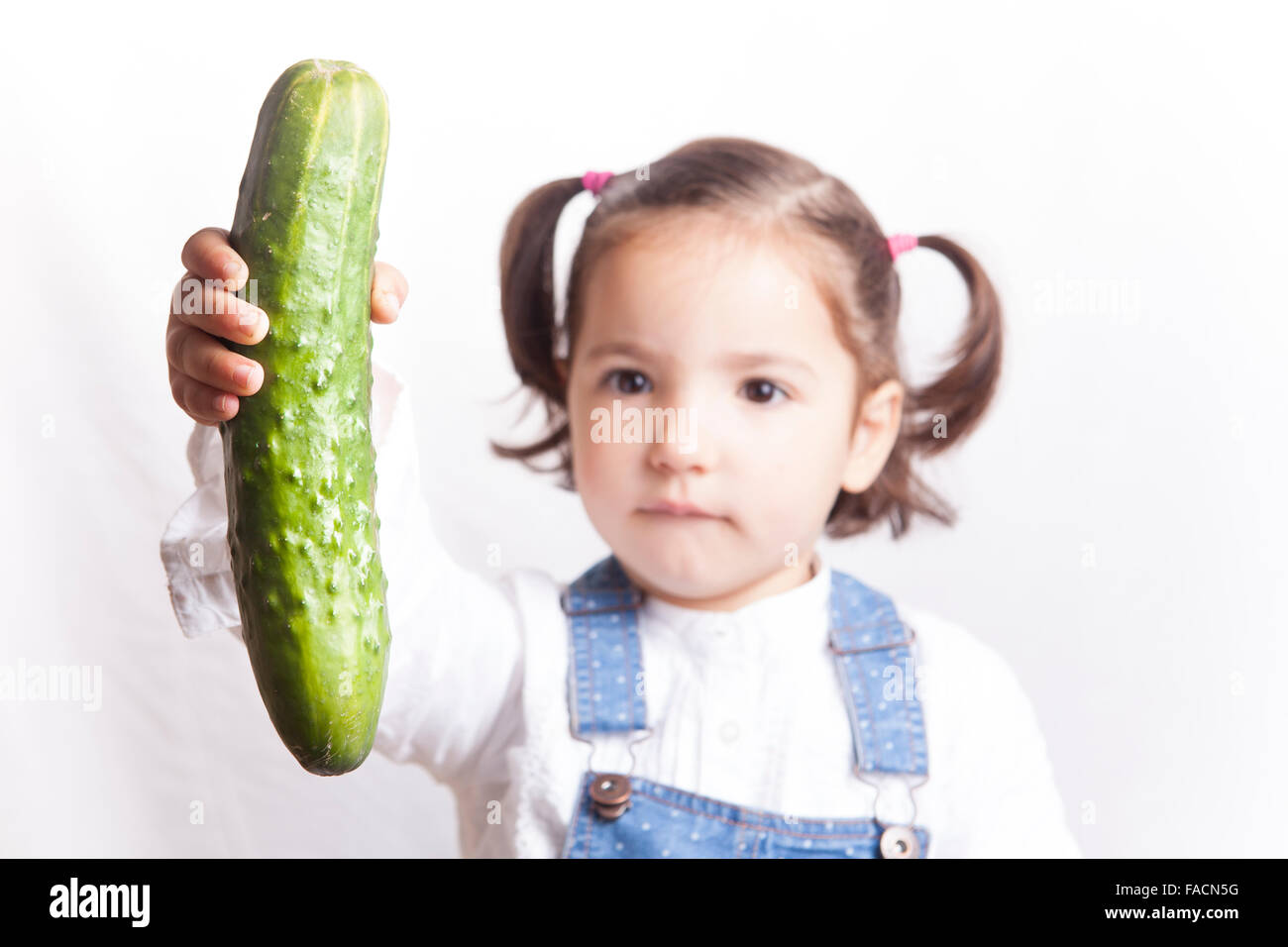 Girl with cucumber hi-res stock photography and images - Alamy