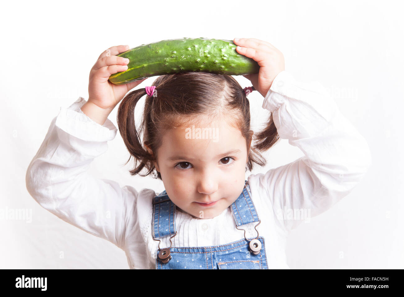 Girl with cucumber hi-res stock photography and images - Alamy