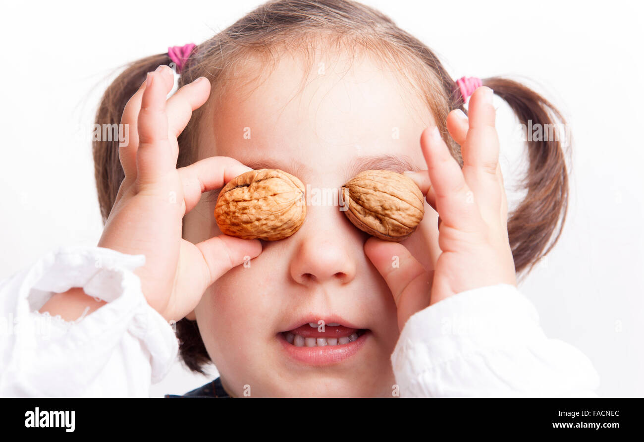 Portrait of playing with nuts. Isolated over white background Stock ...