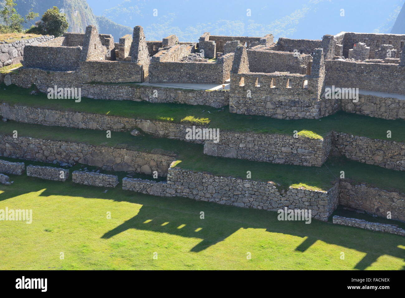 The sun rises over the urban sector at the Inca ruins at Machu Picchu ...