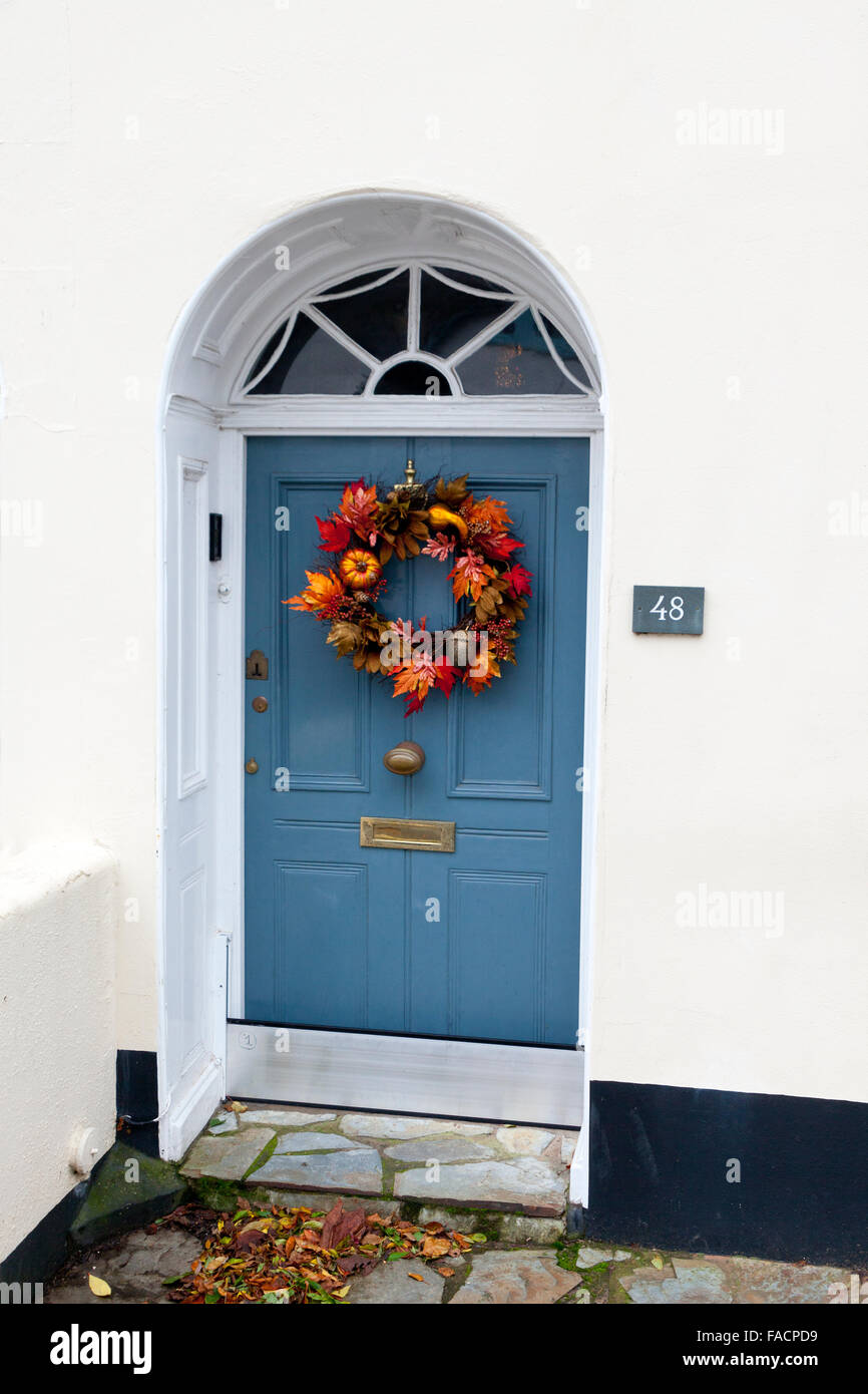A colourful circular autumn wreath and flood protection board on a ...