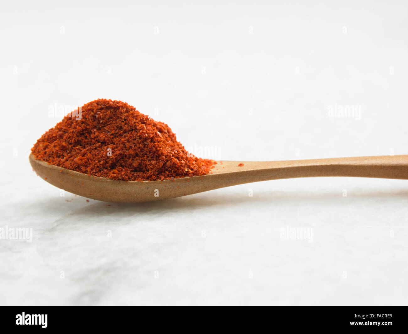 spoon full of the chilli powder Stock Photo - Alamy