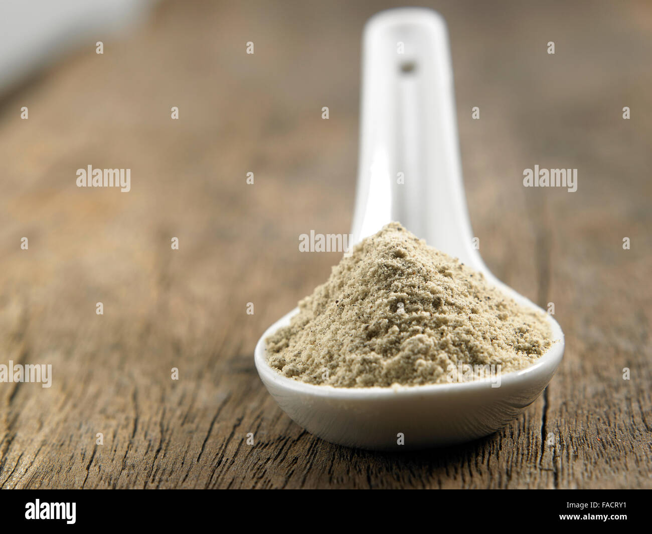 saucer full with pepper powder Stock Photo - Alamy