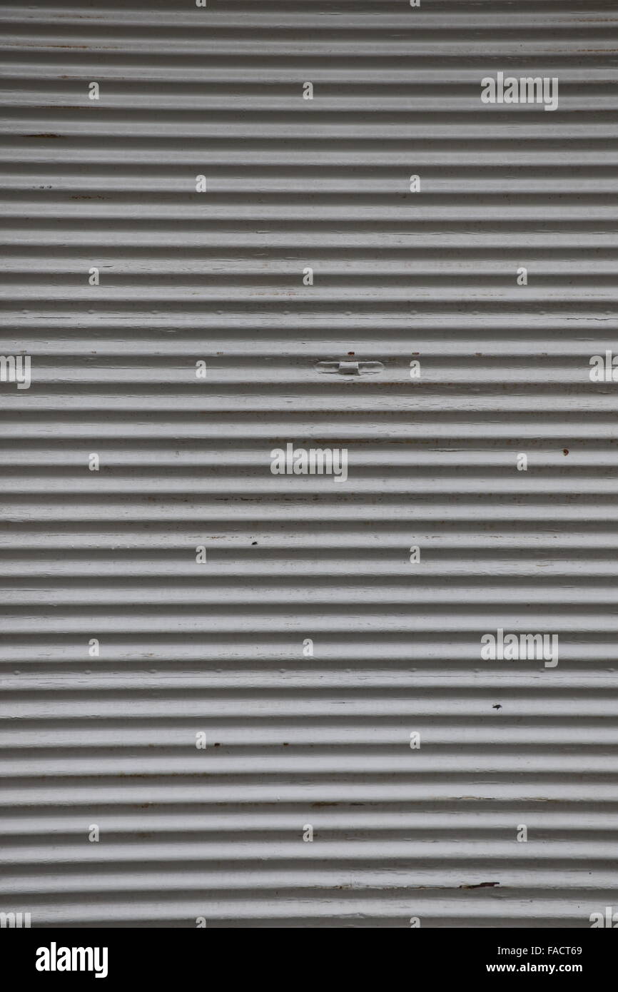 Old metal store shutters closed and shut up Stock Photo - Alamy