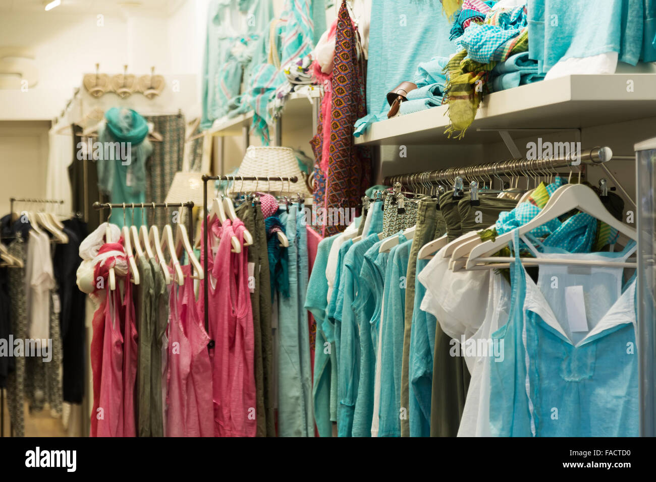Interior of clothes shop with blue dresses Stock Photo - Alamy