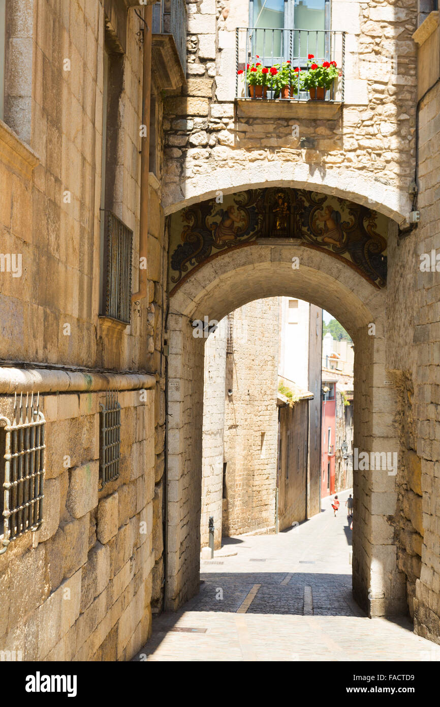 Arch over old narrow street of european city. Girona, Spain Stock Photo ...