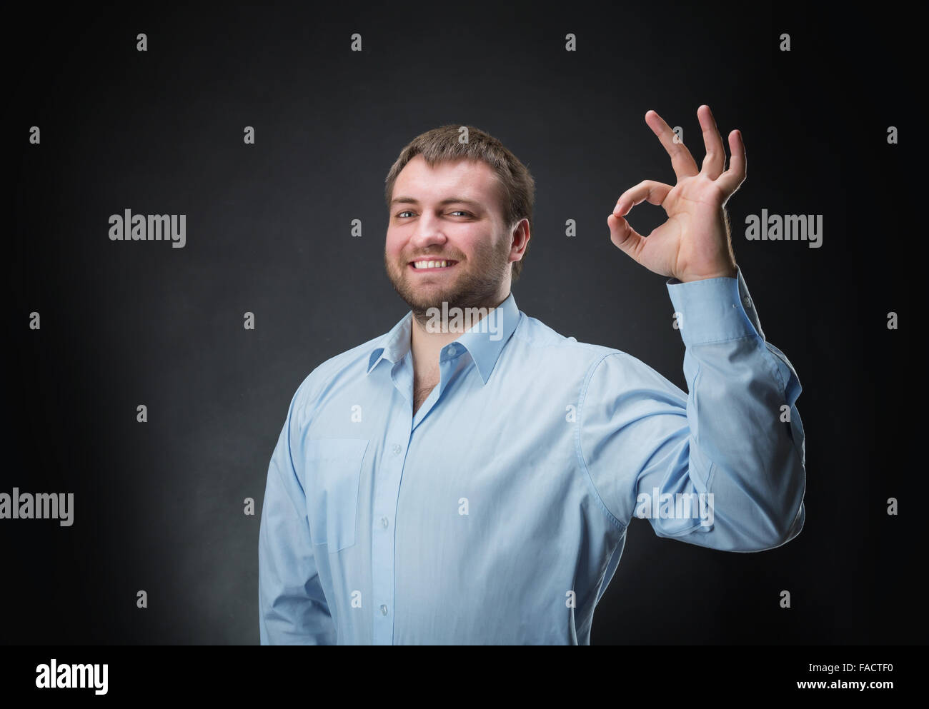 Man showing ok-sign Stock Photo - Alamy