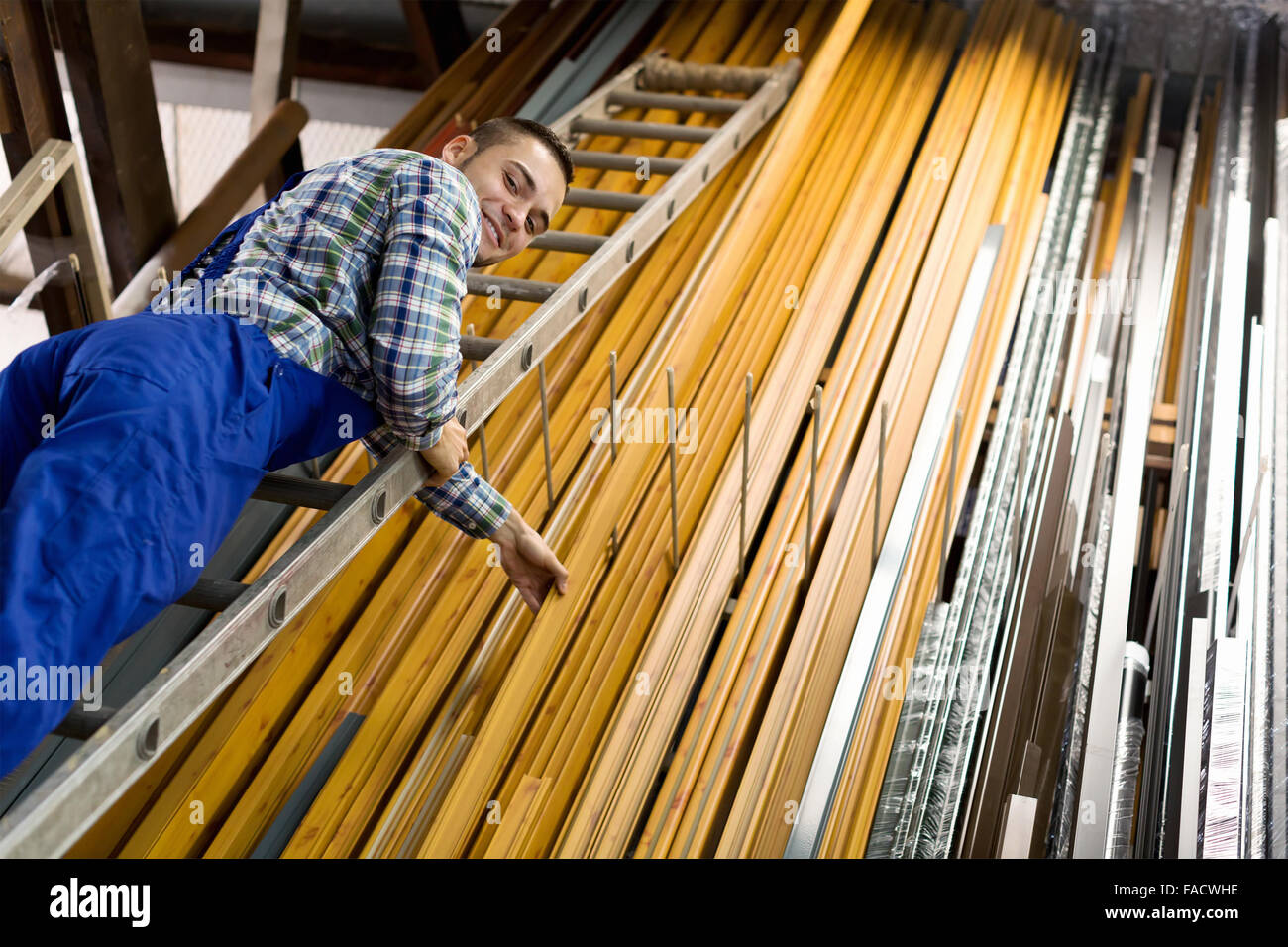Production worker in uniform with different PVC window profiles Stock ...