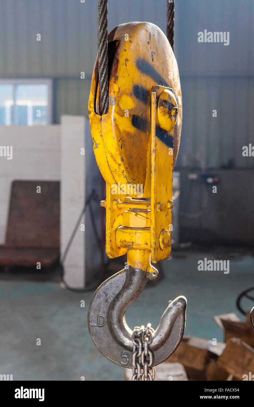Old yellow iron hook Stock Photo - Alamy