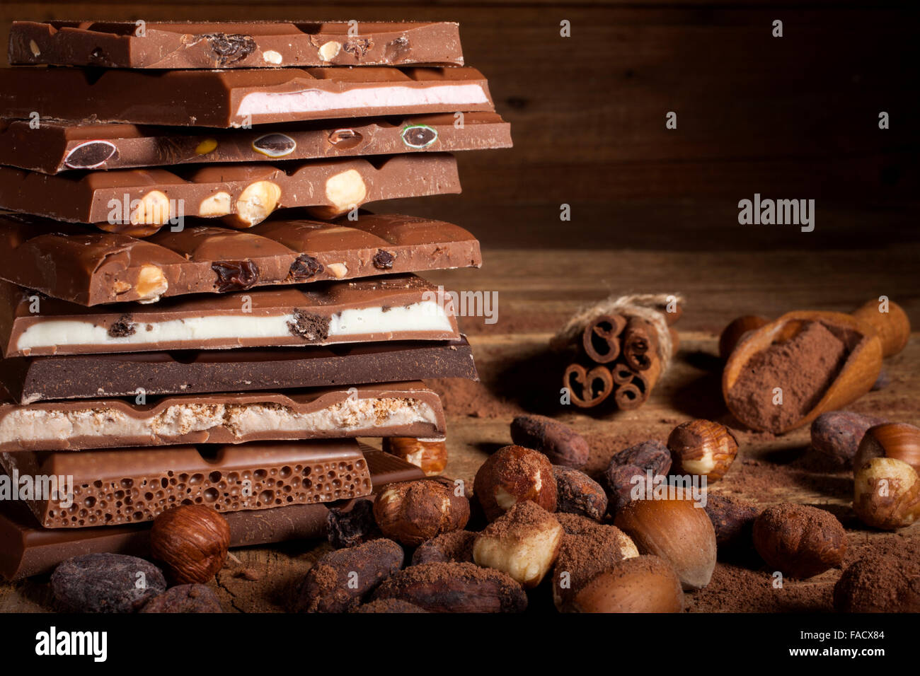 Chocolate stack on wooden background Stock Photo - Alamy