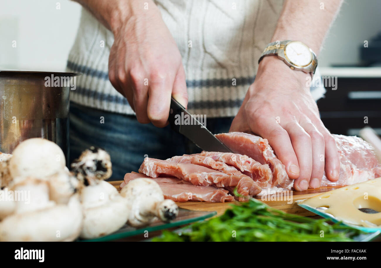 Steps of cooking french-style meat. Hands cutting meat Stock Photo - Alamy