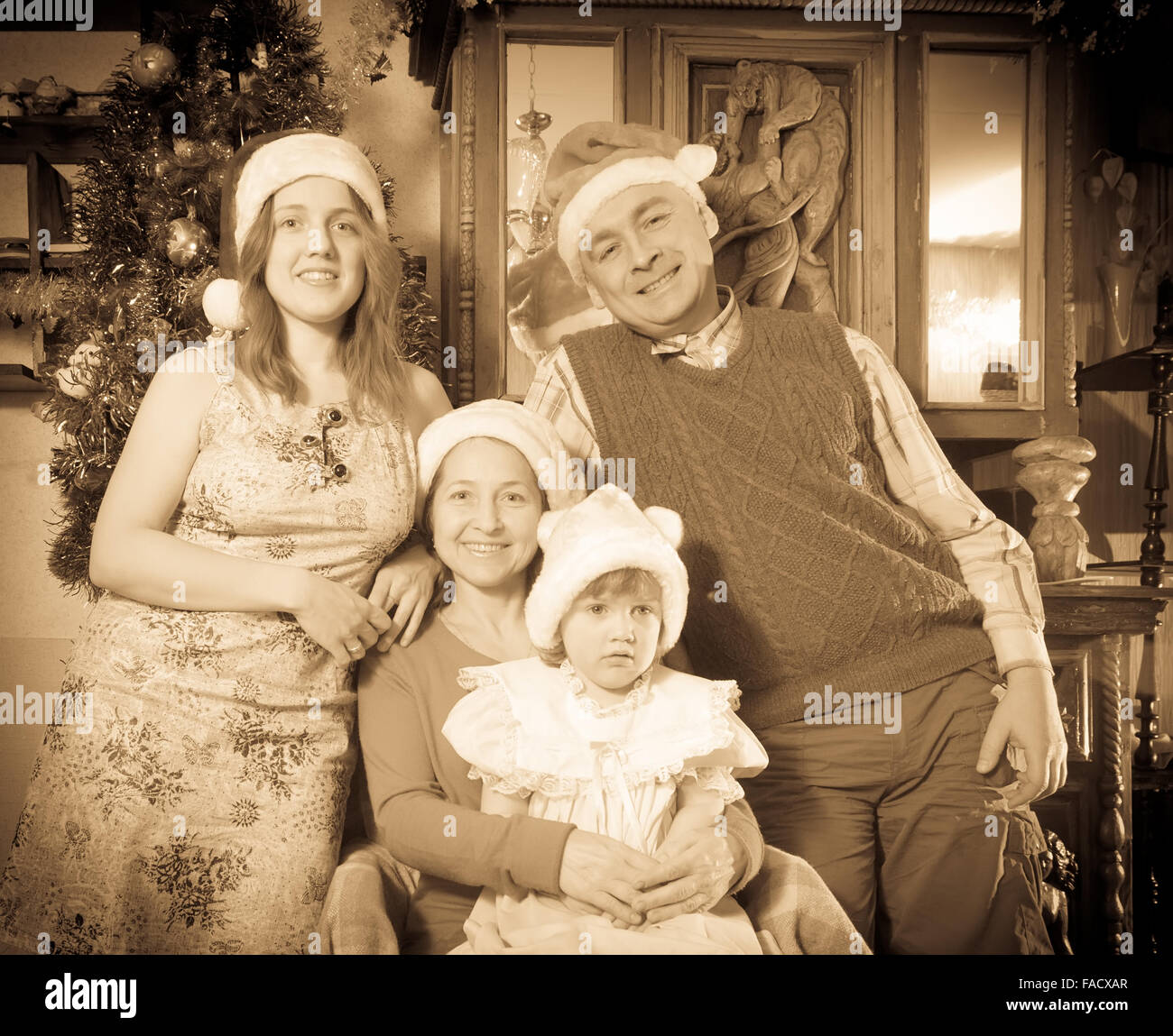 Imitation of antique photo of happy three generations family posing for ...