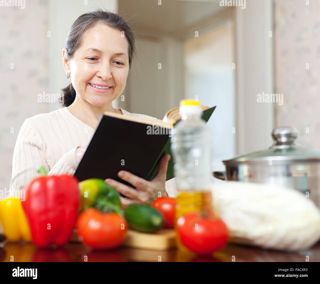 Mature woman fun with tomato hi-res stock photography and images - Alamy