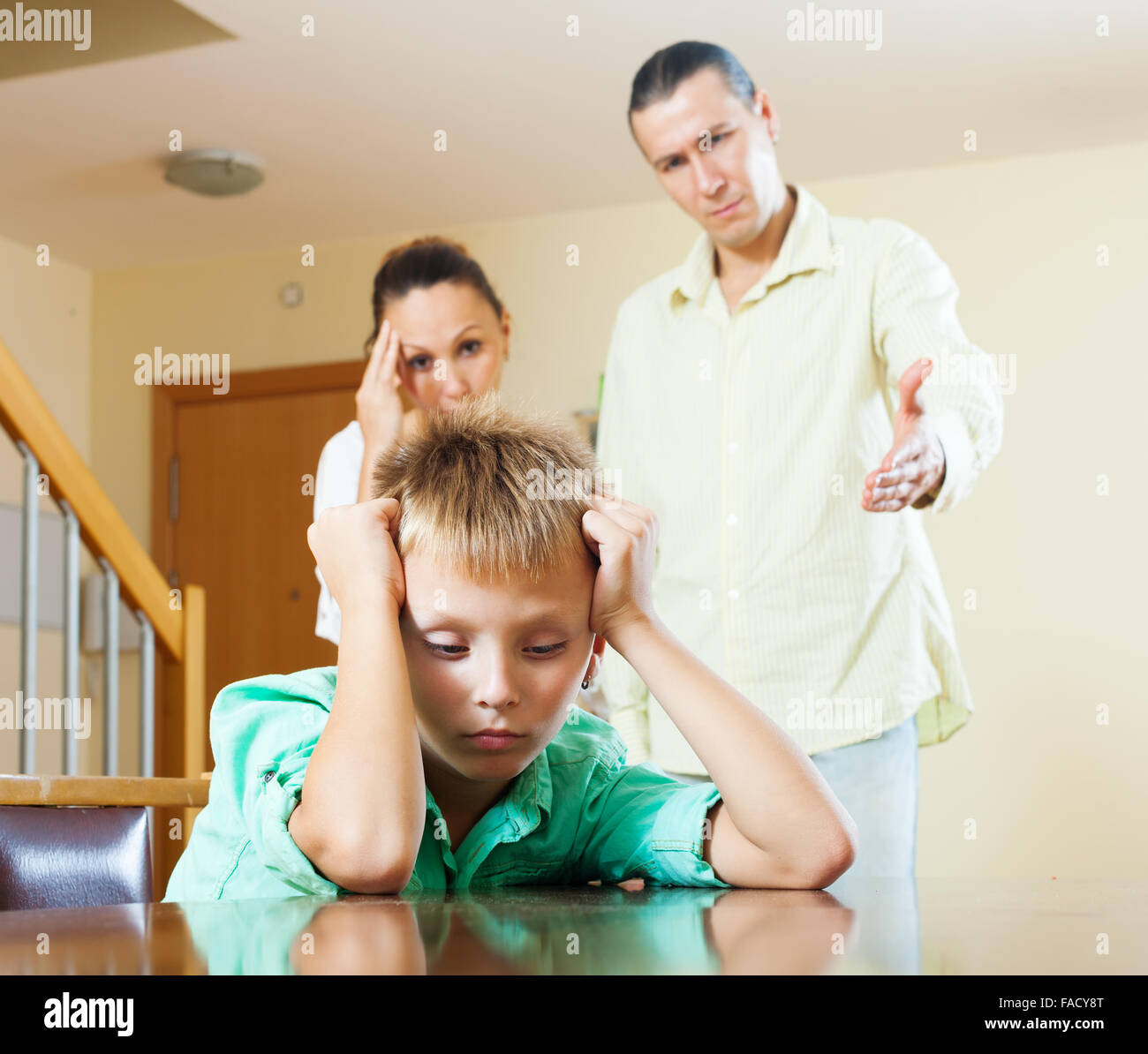 family of three with teenage son having conflict. Focus on boy Stock ...