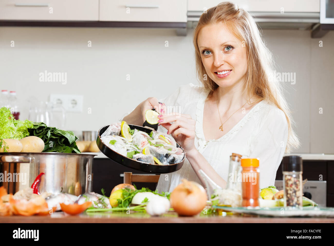 Putting fish in pan hi-res stock photography and images - Alamy