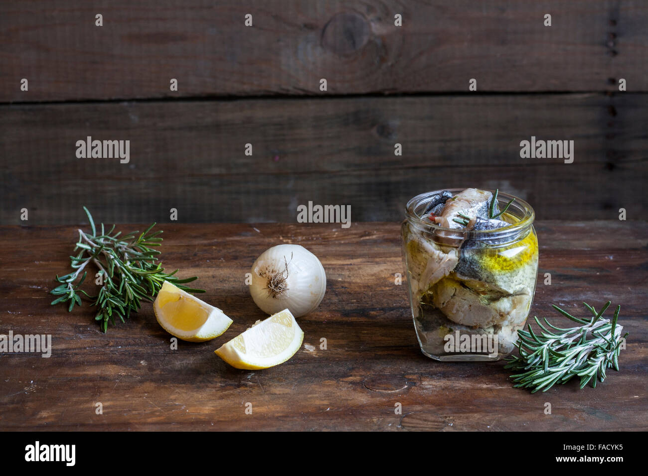Preserved marinated sliced fish in a glass jar Stock Photo - Alamy