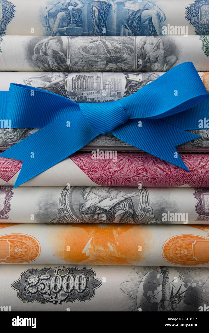 BLUE BIRTHDAY PRESENT RIBBON AROUND PAPER BONDS AND STOCK CERTIFICATES ...