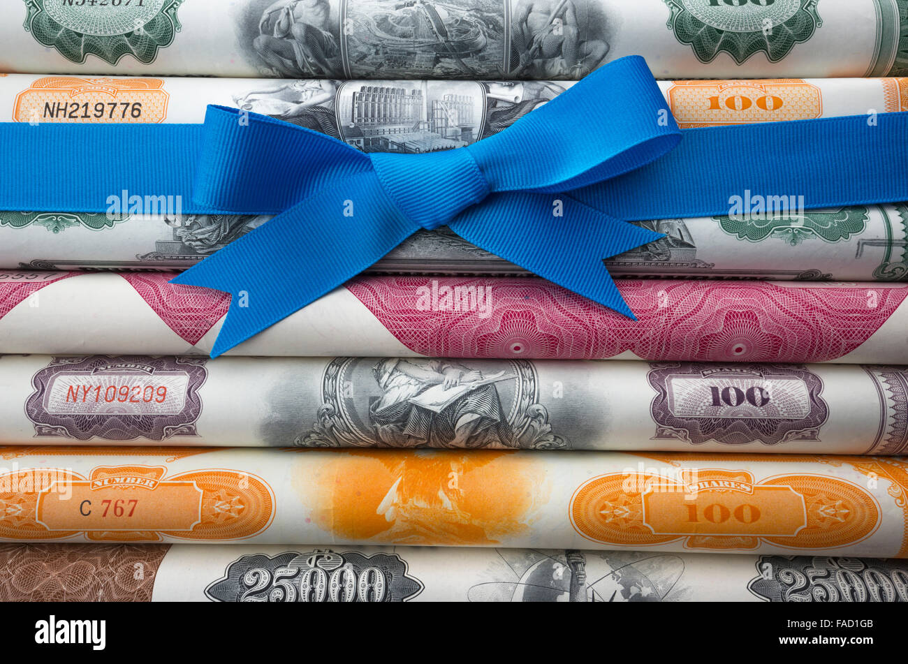 BLUE BIRTHDAY PRESENT RIBBON AROUND PAPER BONDS AND STOCK CERTIFICATES ...
