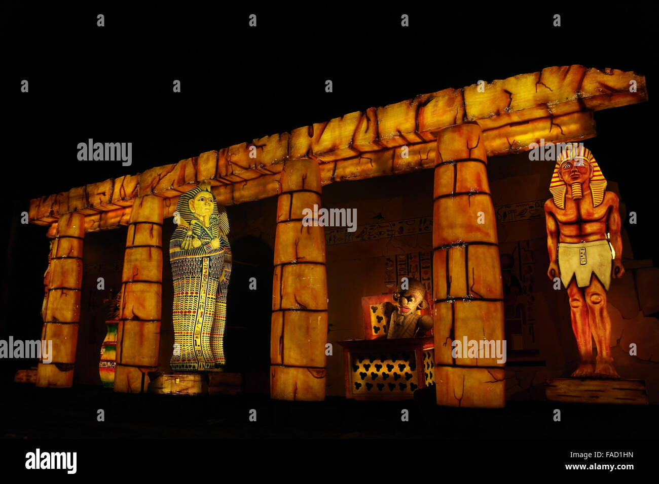 Oblique night view open sarcophagus next to pop-up mummy image with ...