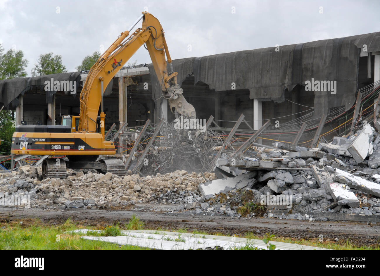 heavy machinery are breaking down old buildings Stock Photo - Alamy