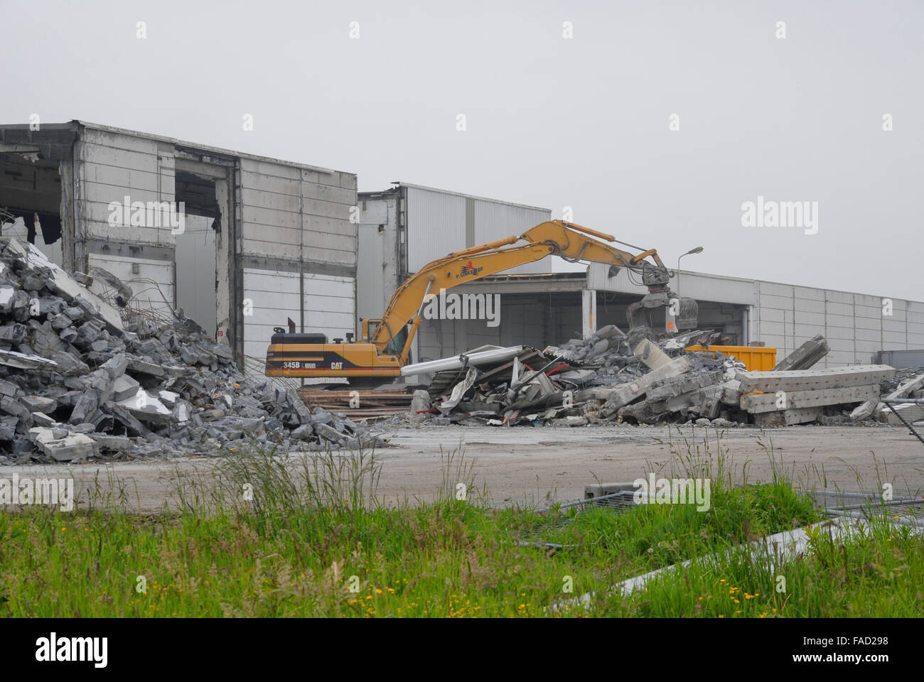 heavy machinery are breaking down old buildings Stock Photo - Alamy