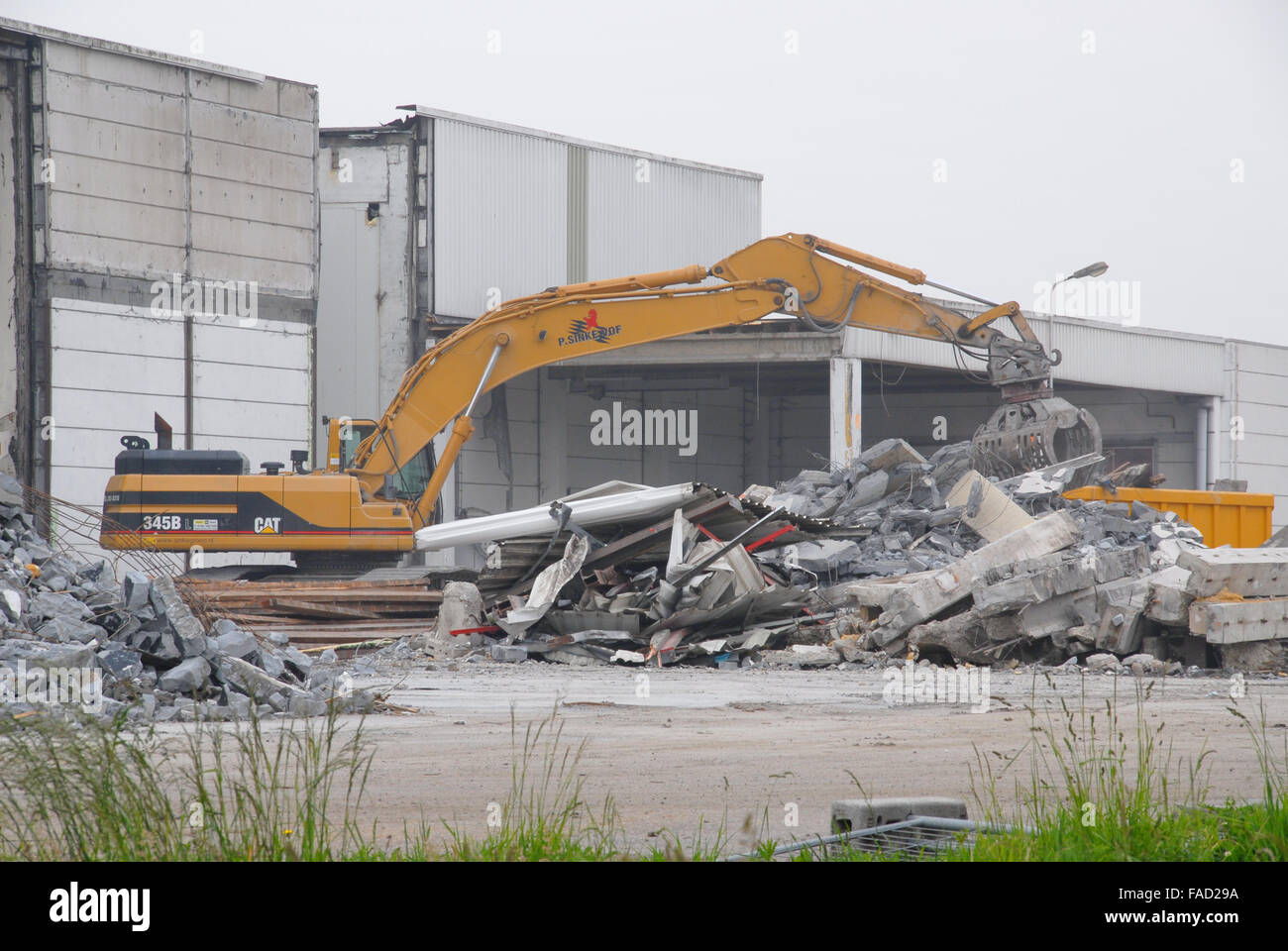 heavy machinery are breaking down old buildings Stock Photo - Alamy