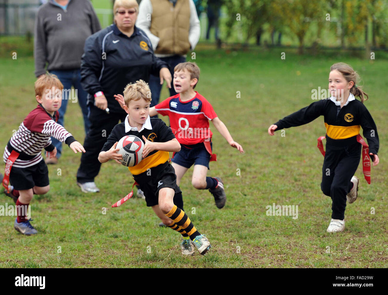 Childrens junior tag rugby action Britain Uk children childrens sport ...