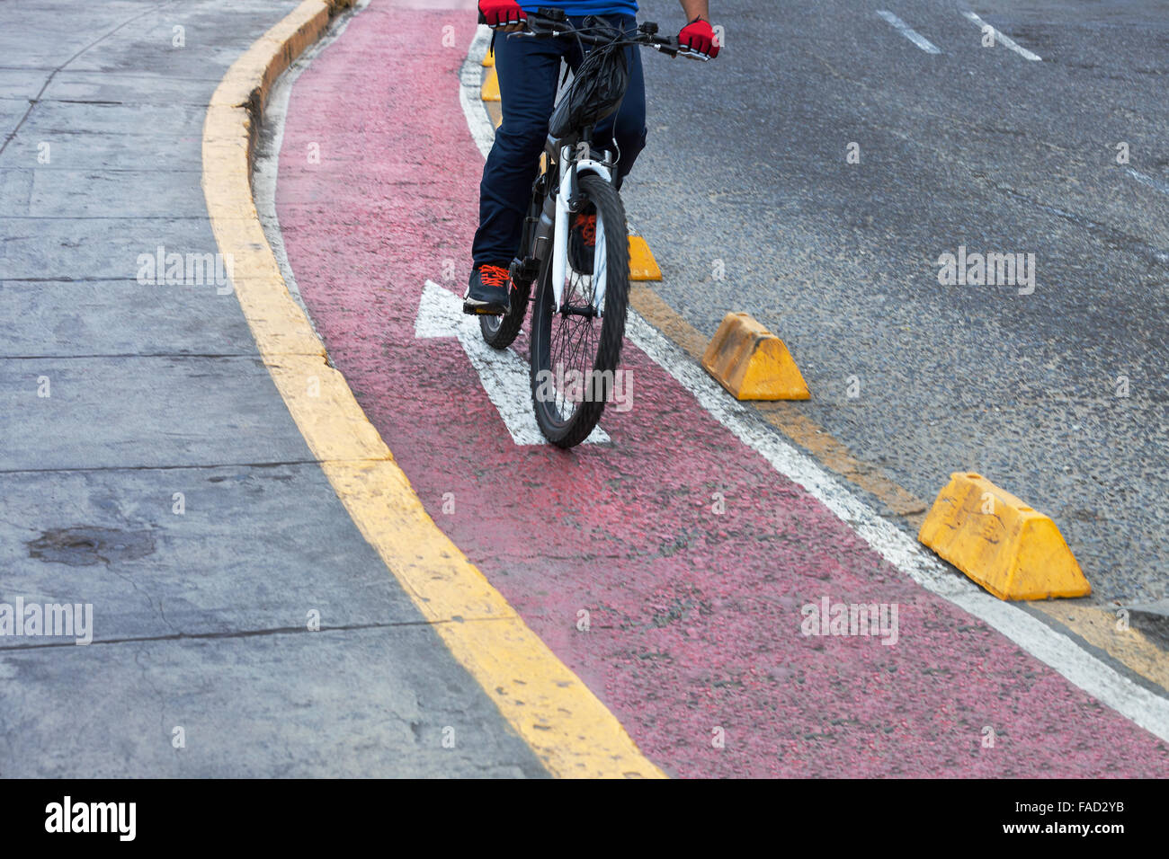 bicyclist red bike path in the modern city Stock Photo - Alamy
