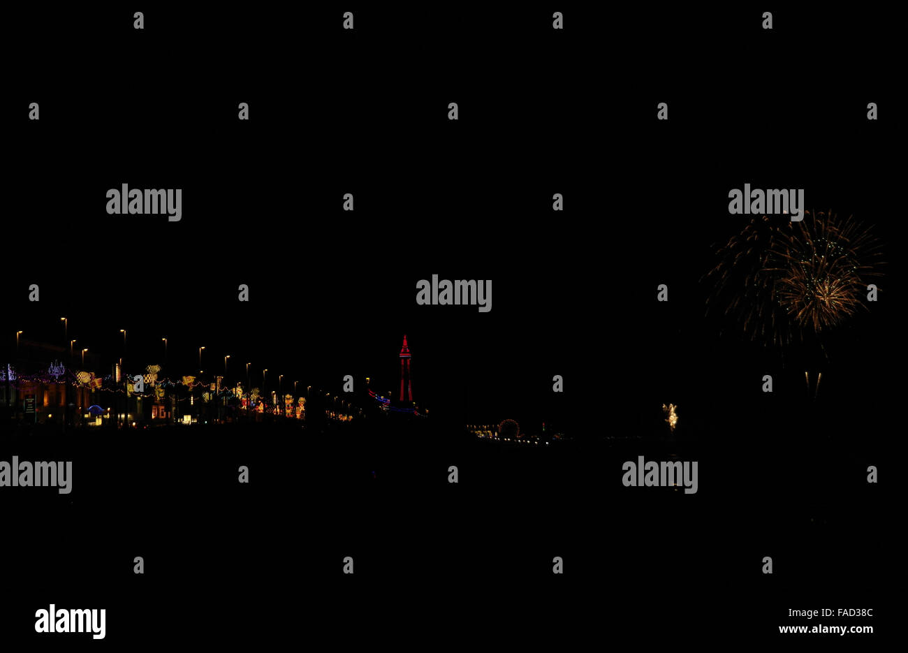 Night view Queen's Promenade Cliffs south to red Blackpool Tower ...