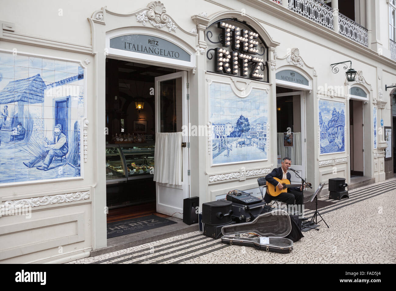 A guitar player in front of the Ritz Cafe on Avenida Arriaga. Funchal ...