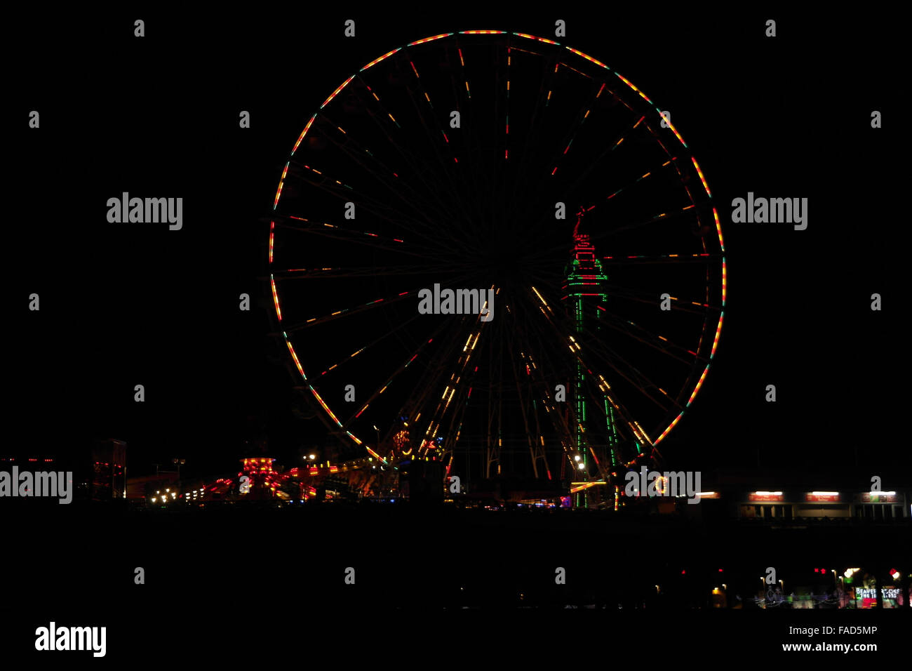 Blackpool tower red green colours illuminated standing rising centre ...