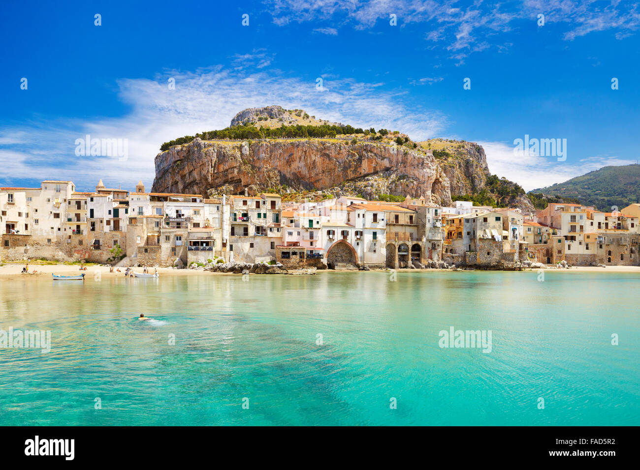 Medieval houses and La Rocca Hill, Cefalu, Sicily, Italy Stock Photo ...