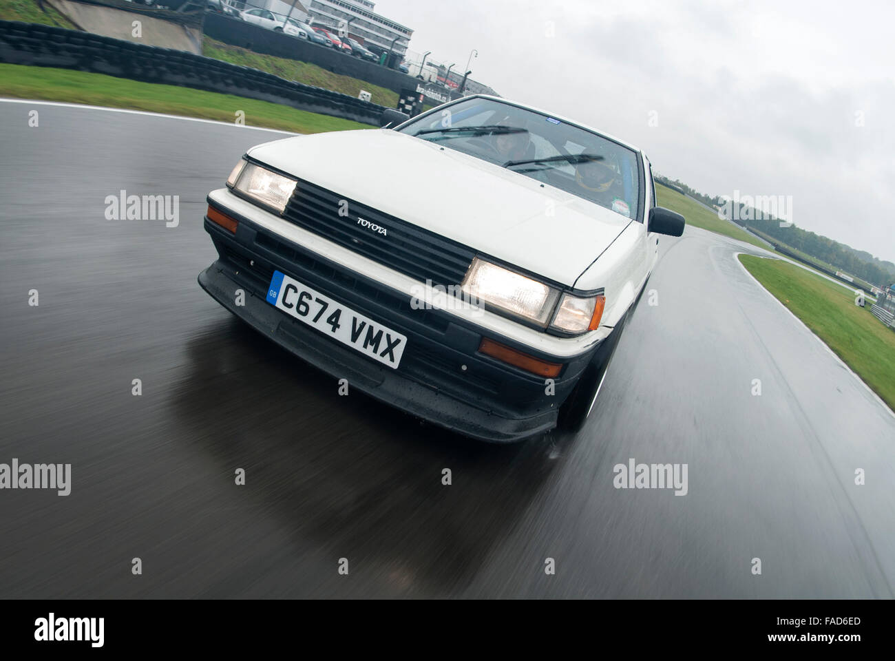 Toyota AE86 Levin modern classic car driving in the rain Stock Photo ...