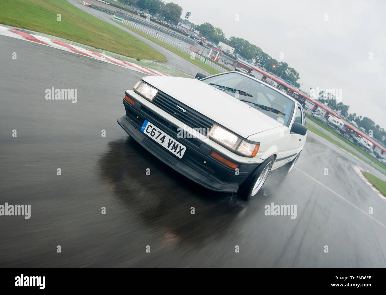 Toyota AE86 Levin modern classic car driving in the rain Stock Photo ...