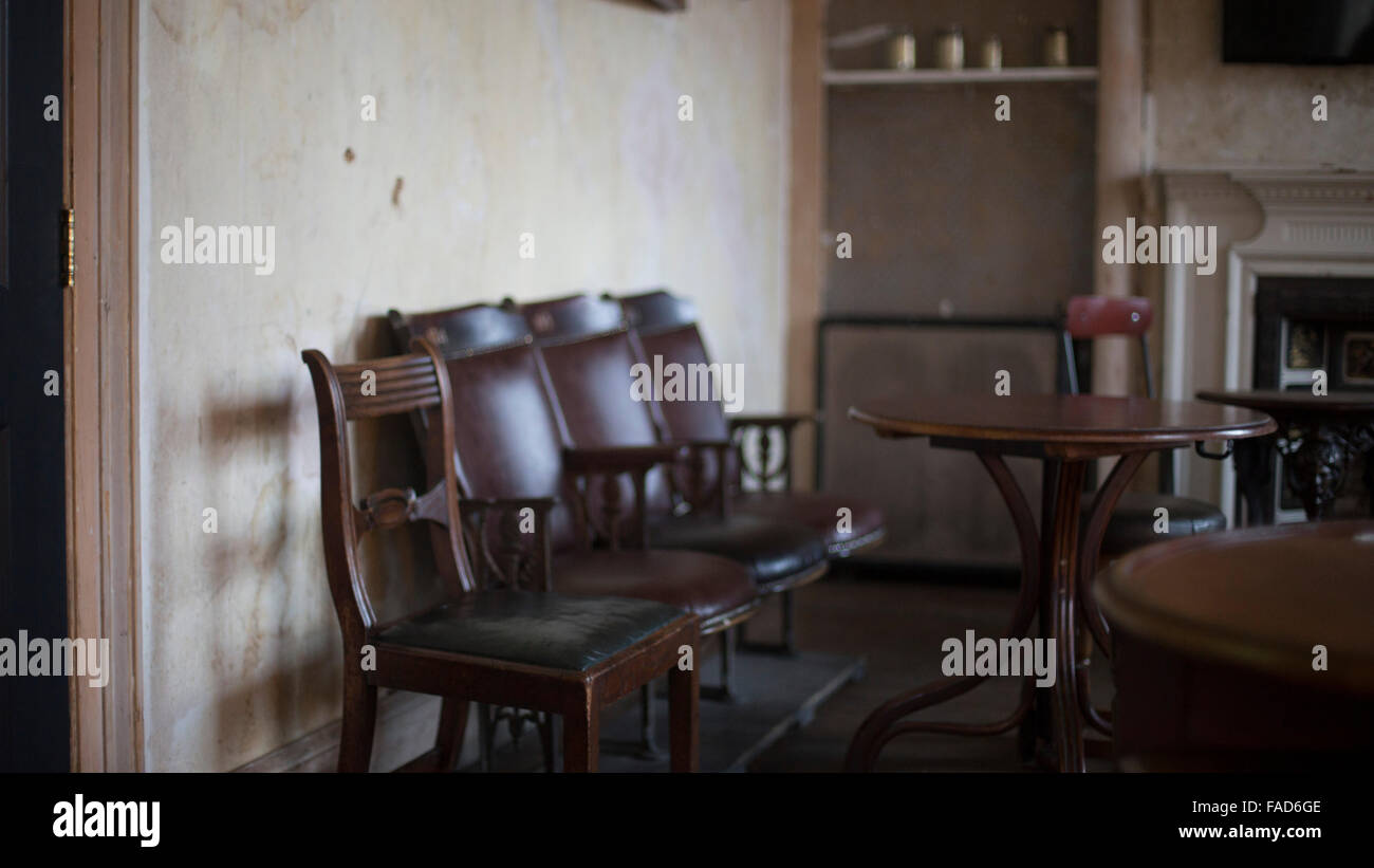 Chairs inside an empty pub Stock Photo - Alamy