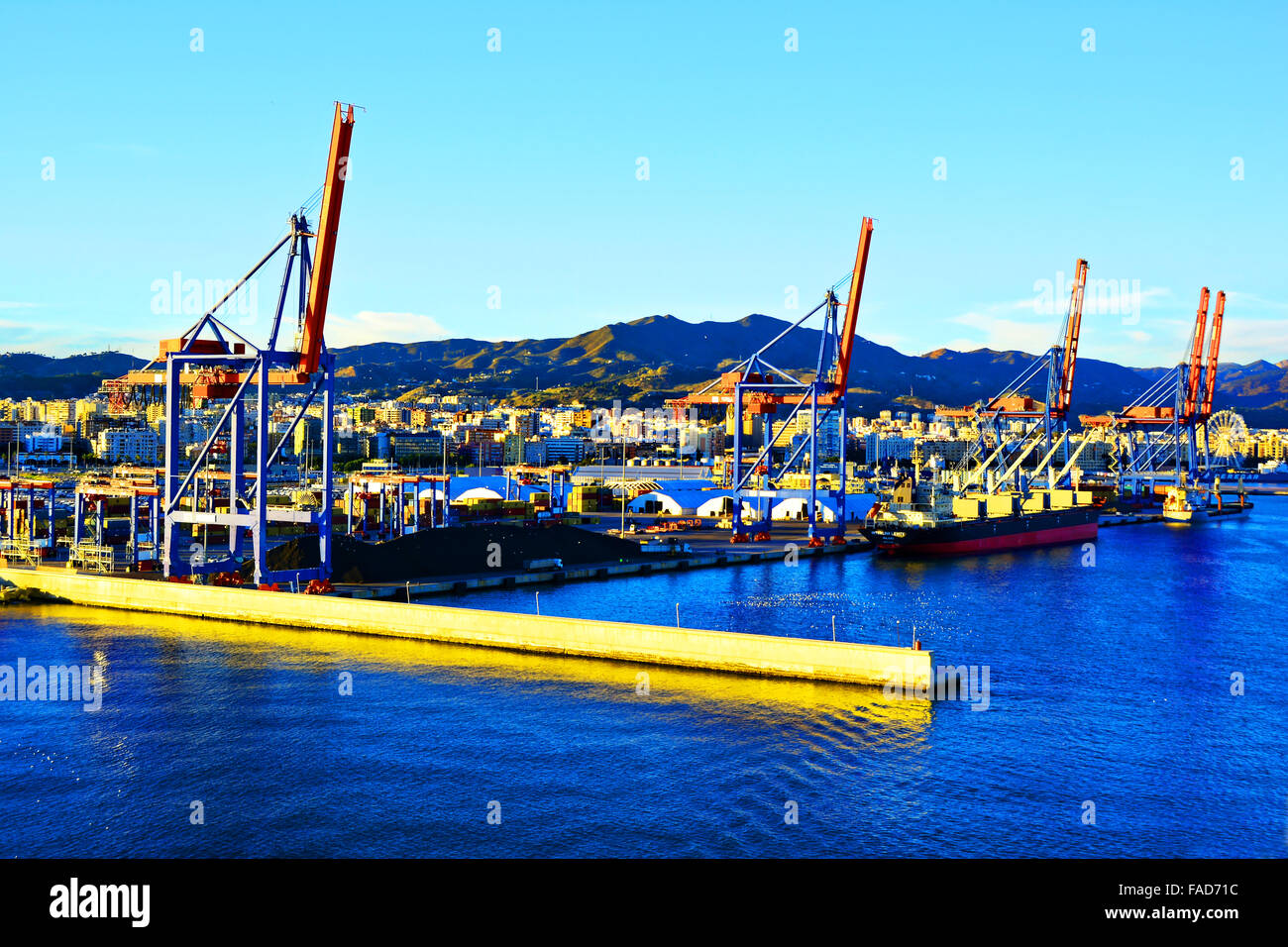Malaga Spain industrial harbour docks cranes Stock Photo - Alamy