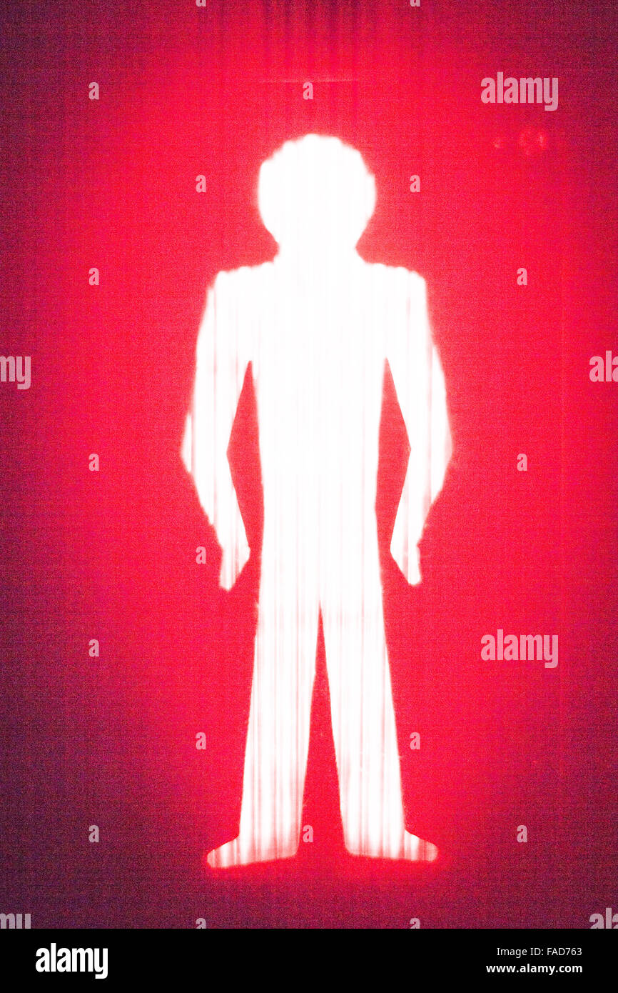 Green man go pedestrian traffic light sign Stock Photo - Alamy