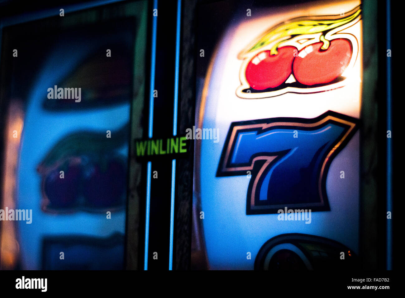 One arm bandit slot machine reels showing numbers in casino at night ...