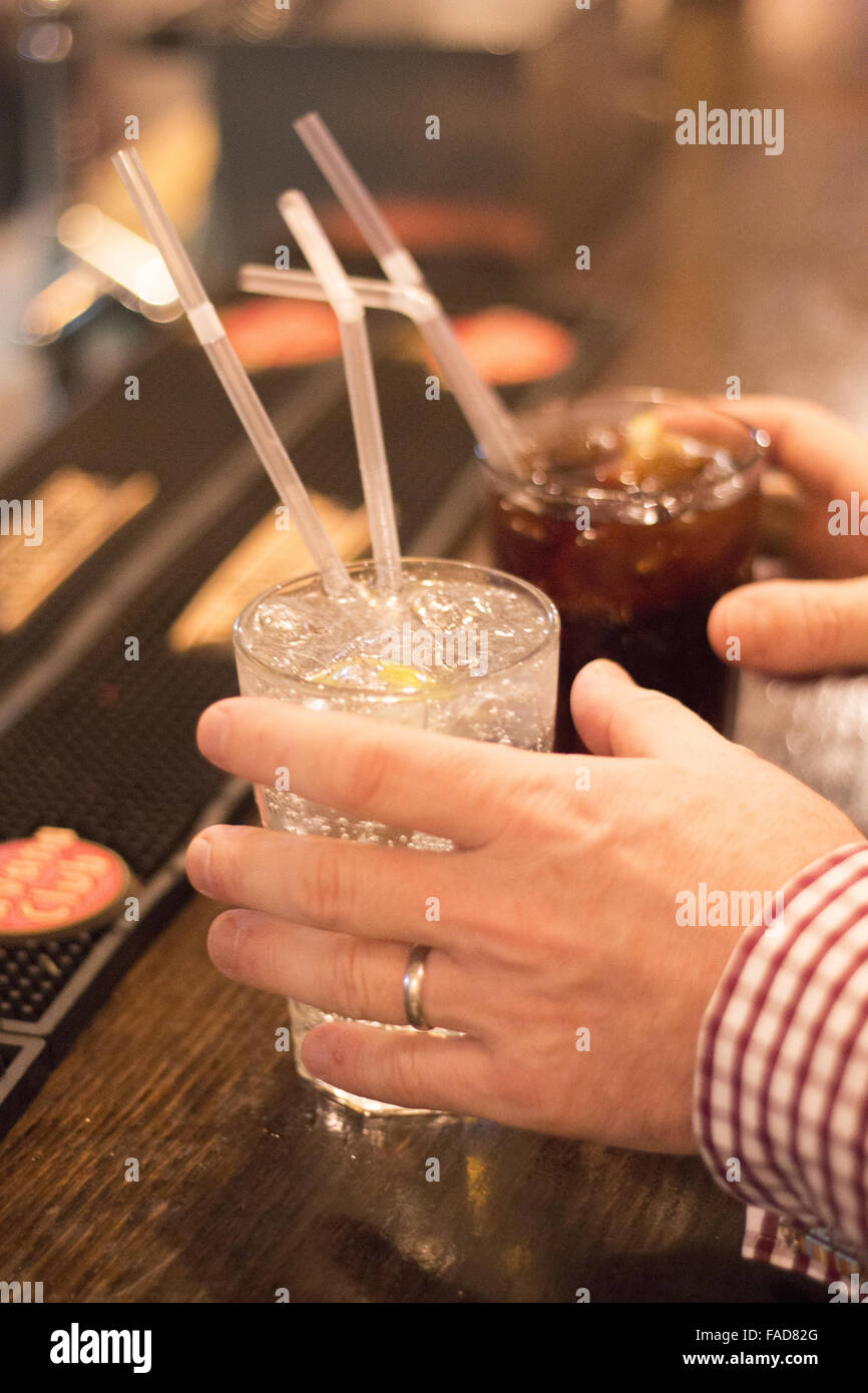 Glasses and drinking straw in bar in wedding reception party photo ...