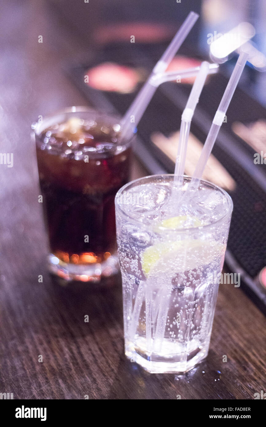 Glasses and drinking straw in bar in wedding reception party photo ...