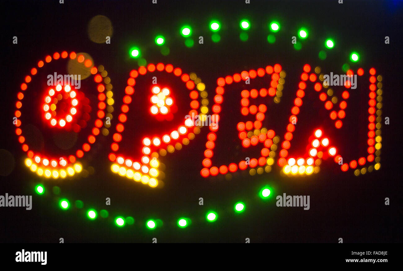 Neon shop open store sign at night in street photo Stock Photo - Alamy