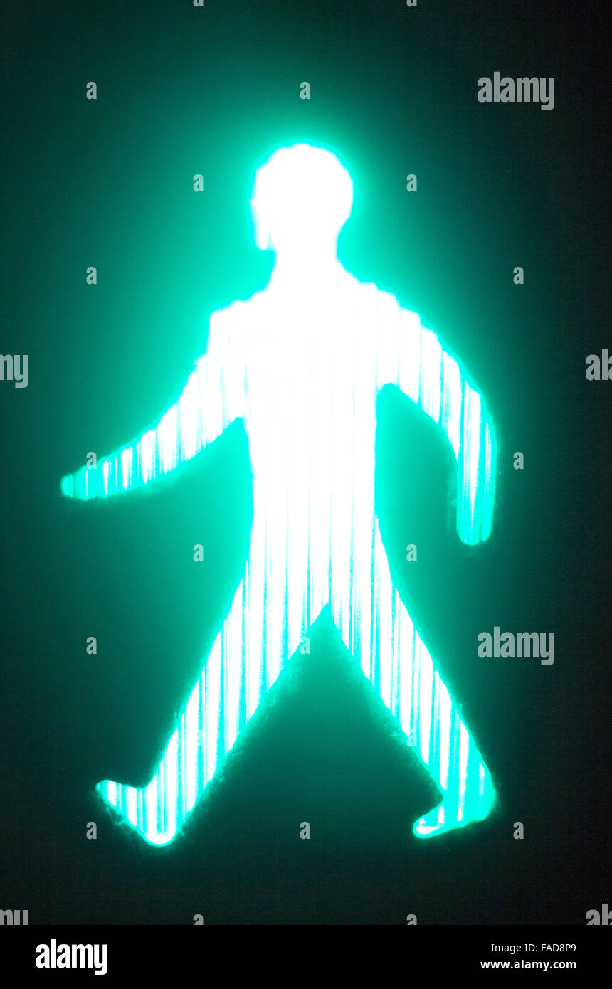 Green man go pedestrian traffic light sign Stock Photo - Alamy